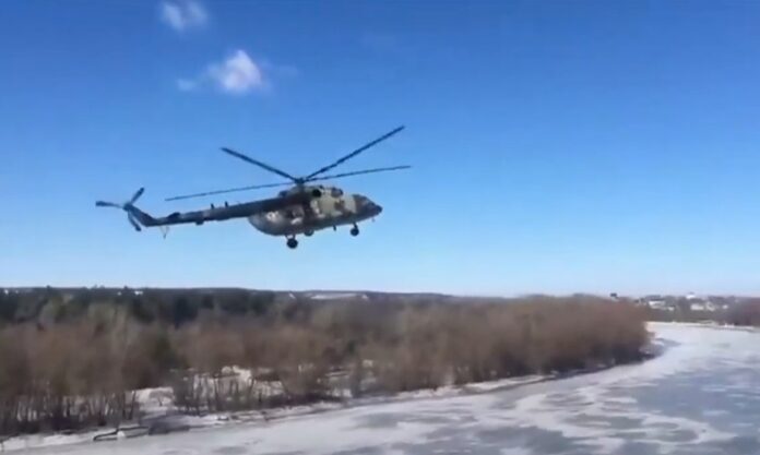 Russian military helicopter hits power lines
